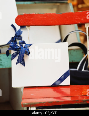 Blue gift box with ribbon on pastel background. Copy space top view ...