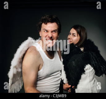 Mr. Angel and Mrs. Angel. Creepy character portrait Stock Photo - Alamy