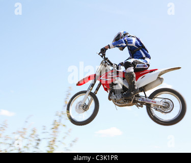 Motocross bike in mid air Stock Photo - Alamy