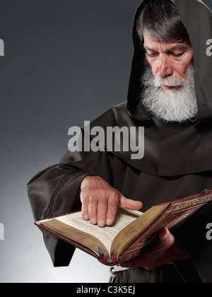 Monk reading the Bible Stock Photo - Alamy