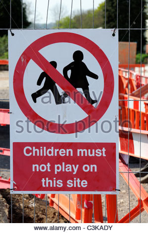 'Children must not play on this site' safety sign attached to a fence ...