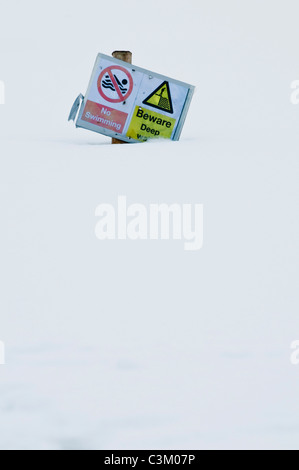 Danger Thin Ice signs over frozen water Stock Photo - Alamy