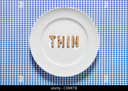 Word thin written with russian bread on dish, close up Stock Photo - Alamy