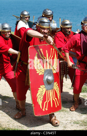 Roman Soldiers demonstrating defensive battle formation using shields ...