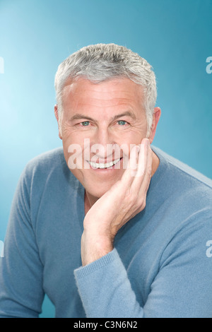Happy mature man with gray hair at beach Stock Photo - Alamy