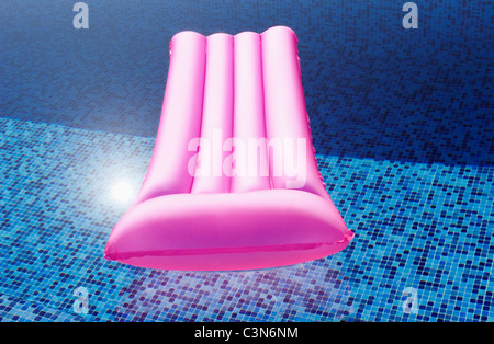 A Lilo floating in a pool Stock Photo - Alamy