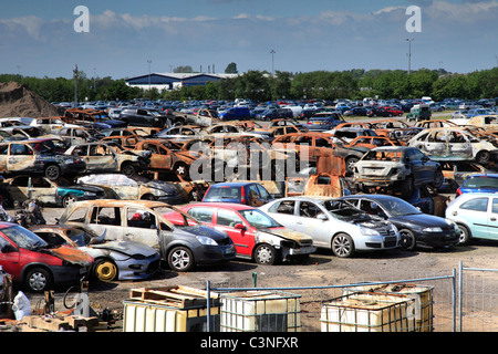 Scrap yard with burnt out cars & vans Stock Photo - Alamy