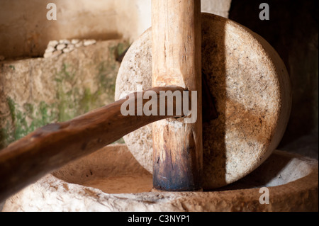 A large millstone used for pressing olives to make olive oil at a ...