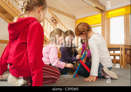 Germany, Children in nursery playing together, smiling, portrait Stock ...
