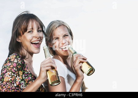 Germany, Cologne, Women enjoying beer, smiling Stock Photo - Alamy