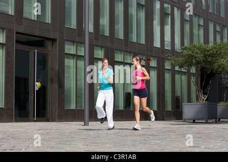 Germany, Cologne, Young women jogging Stock Photo - Alamy