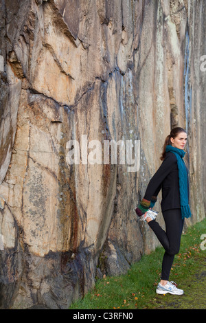 Woman in front of Face Rock, a sandstone rock formation in shape of ...