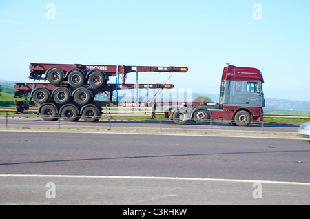 Articulated lorry transporting trailer units Stock Photo - Alamy