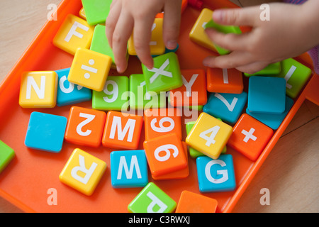 Children's colourful alphabet letters and numbers tile magnets Stock ...