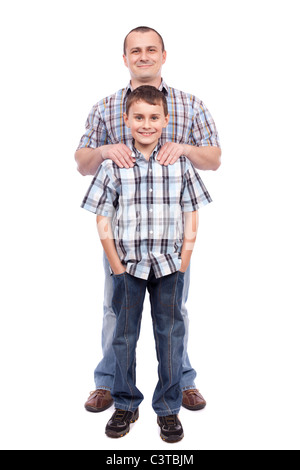 Father and son standing next to each other, isolated on white ...