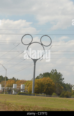 A utility pole shaped in the appearance of Mickey Mouse graces ...