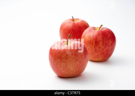 Three red apples Stock Photo - Alamy