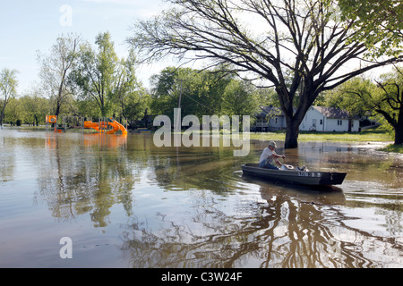 Bill Sandquist paddles past his home in the Red Star District of Cape ...