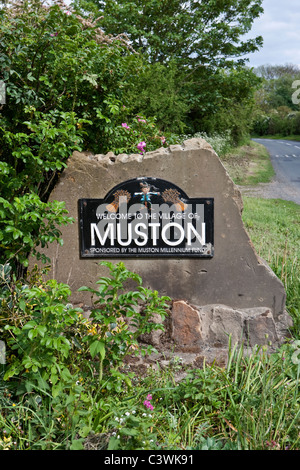 Village name sign Muston North Yorkshire Stock Photo - Alamy
