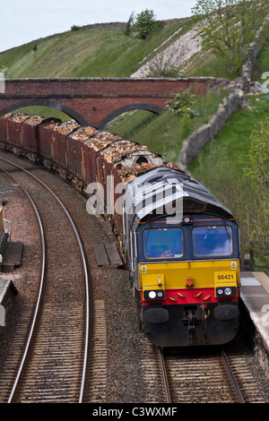 DRS class 66 locomotive hauling a freight train carrying materials for ...