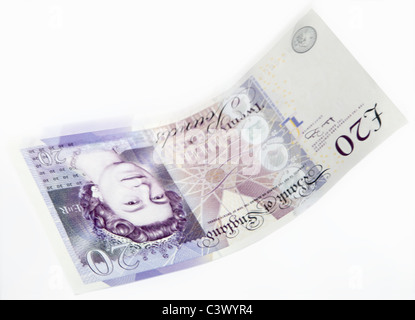 Money floating from above, British Pounds Stirling on a green ...