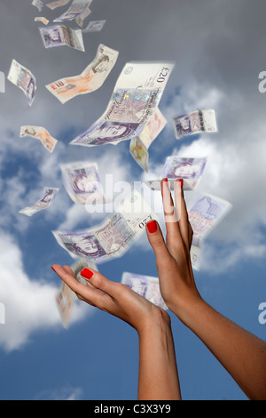 Money floating from above, British Pounds Stirling on a green ...