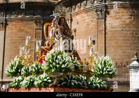 A paso of the Virgin Mary carried in a religious procession past the ...