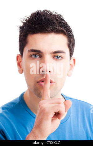Handsome man with gesture of shhh, secret, silence, conspiracy, gossip ...