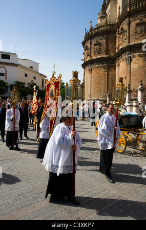 A religious procession starting from the Cathedral in Seville, Spain ...