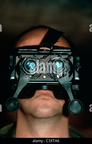 A Secret Service agent wears a mask as he watches President Donald ...