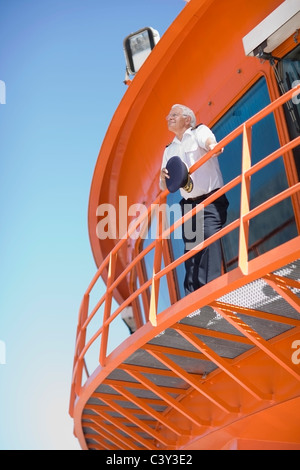 Ships Captain standing on the bridge wing, Mediterranean Sea, Malta ...