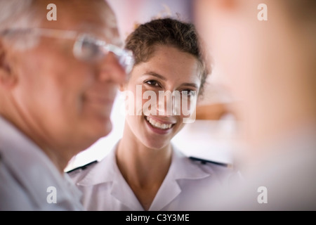 Ship captain on bridge talking on radio Stock Photo - Alamy