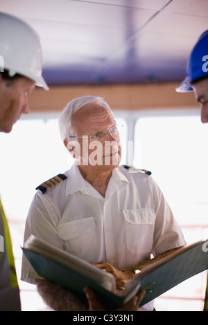 Captain and workers of a ship Stock Photo - Alamy