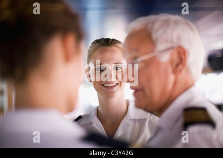 Ship captain on bridge talking on radio Stock Photo - Alamy