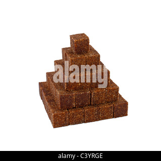 Pyramid made of cane sugar cubes isolated on white Stock Photo - Alamy