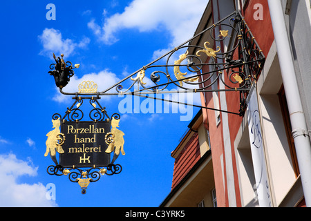 close up of signpost porcelain painting company heidi klinger city of ...