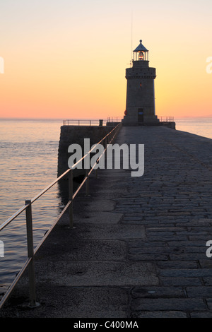 St Peters Port lighthouse at sunrise Stock Photo - Alamy