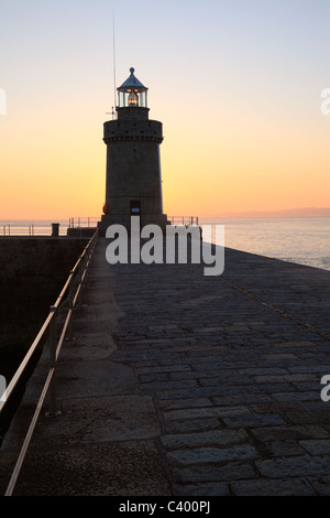 St Peters Port lighthouse at sunrise Stock Photo - Alamy