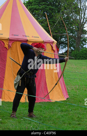 Longbowman demonstrating the use of the weapon at a medieval ...