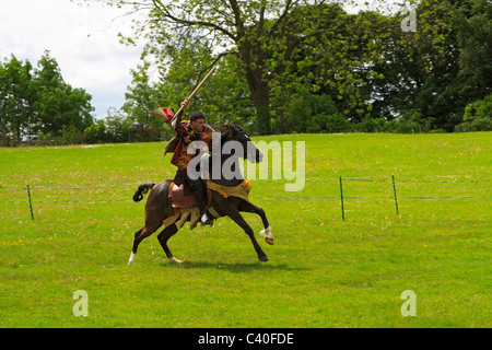 A knight practices throwing a javelin at a medieval reenactment event ...
