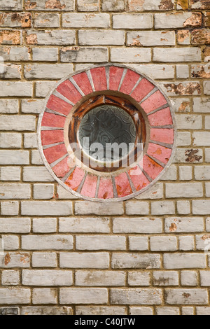 Round window on brick wall on castle Stock Photo - Alamy