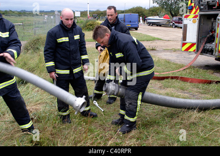 Fire engine suction hose from open water feed Stock Photo - Alamy