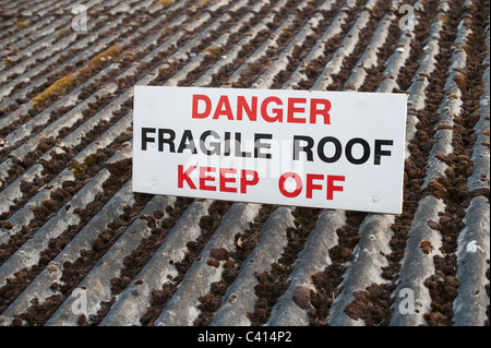 Danger fragile roof keep off sign uk Stock Photo - Alamy