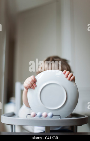 Toddler Sitting in a High Chair in a Modern Kitchen at Home Stock Photo ...