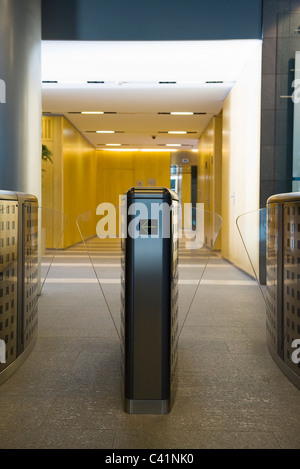 Turnstiles in building lobby Stock Photo - Alamy