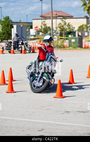 Law enforcement motorcycle teams compete on a cone course at the Bruce ...