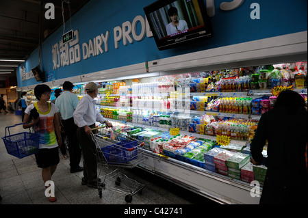 Chinese customers buying dairy products at a Wumart supermarket in ...