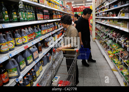 Chinese customers buying sauce at a Wumart in Beijing, China.28-May ...
