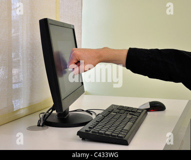 Man`s clenched fist about to hit computer monitor blurred motion Stock ...