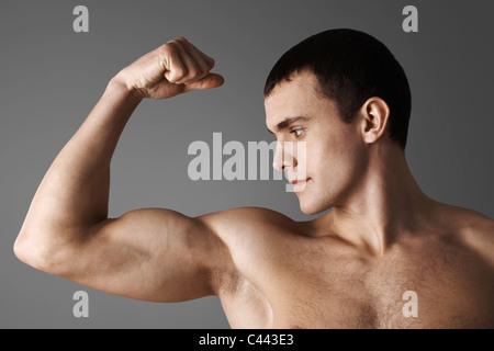 Closeup of male bare arm elbow and biceps isolated on white background ...